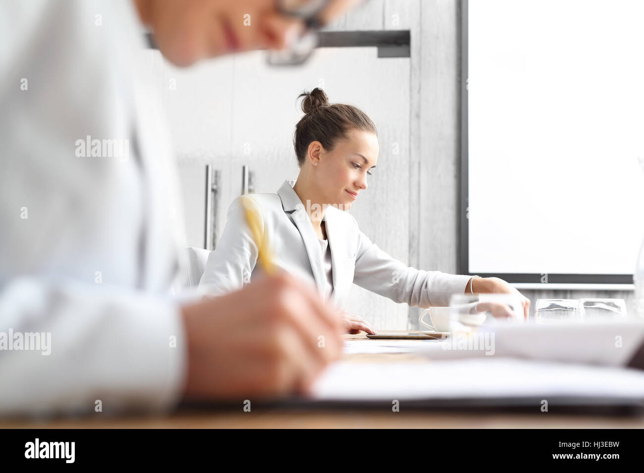 Credit advisor. Signing documents in the office. Office work. Women ...