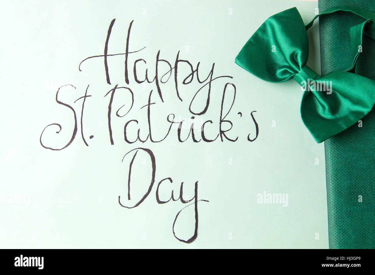 Happy St Patrick day calligraphy card and green accessories Stock Photo ...