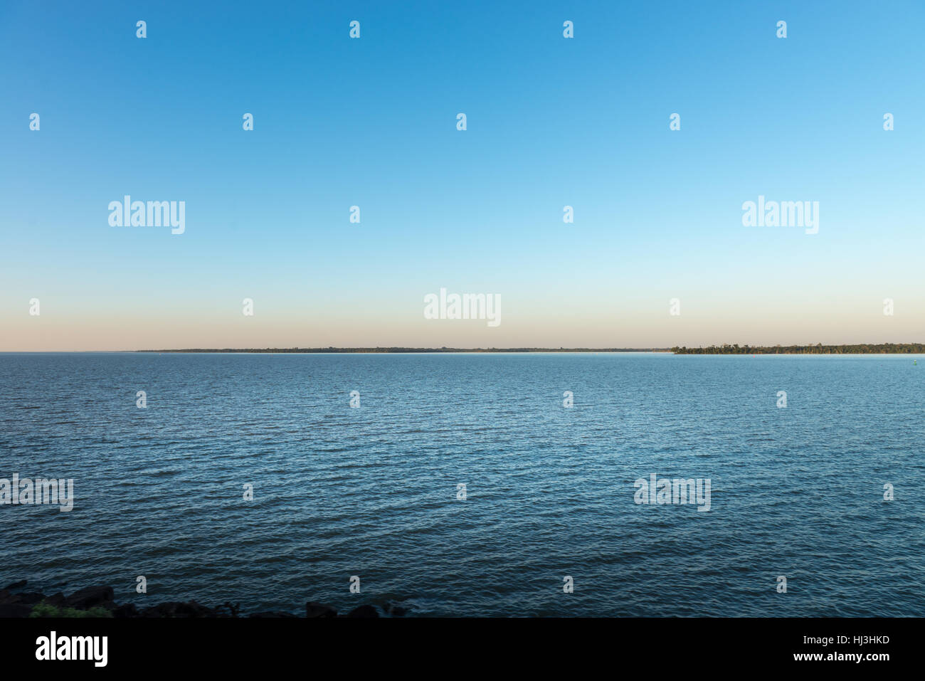 The lake at the parana river in Itaipu dam park at the brazilian border ...