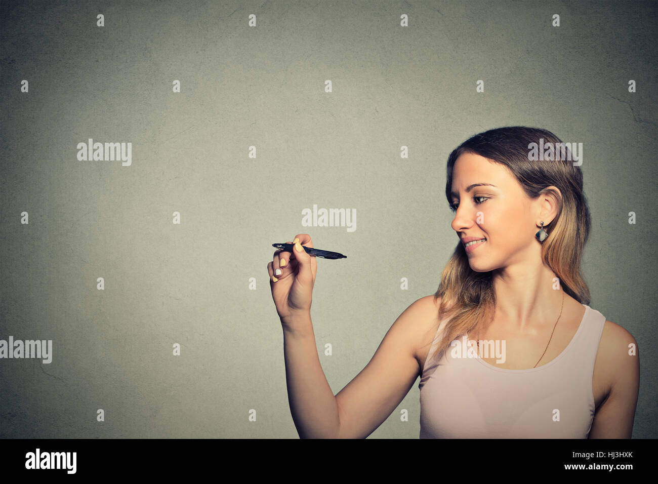 Young woman drawing writing on board with empty copy space Stock Photo ...