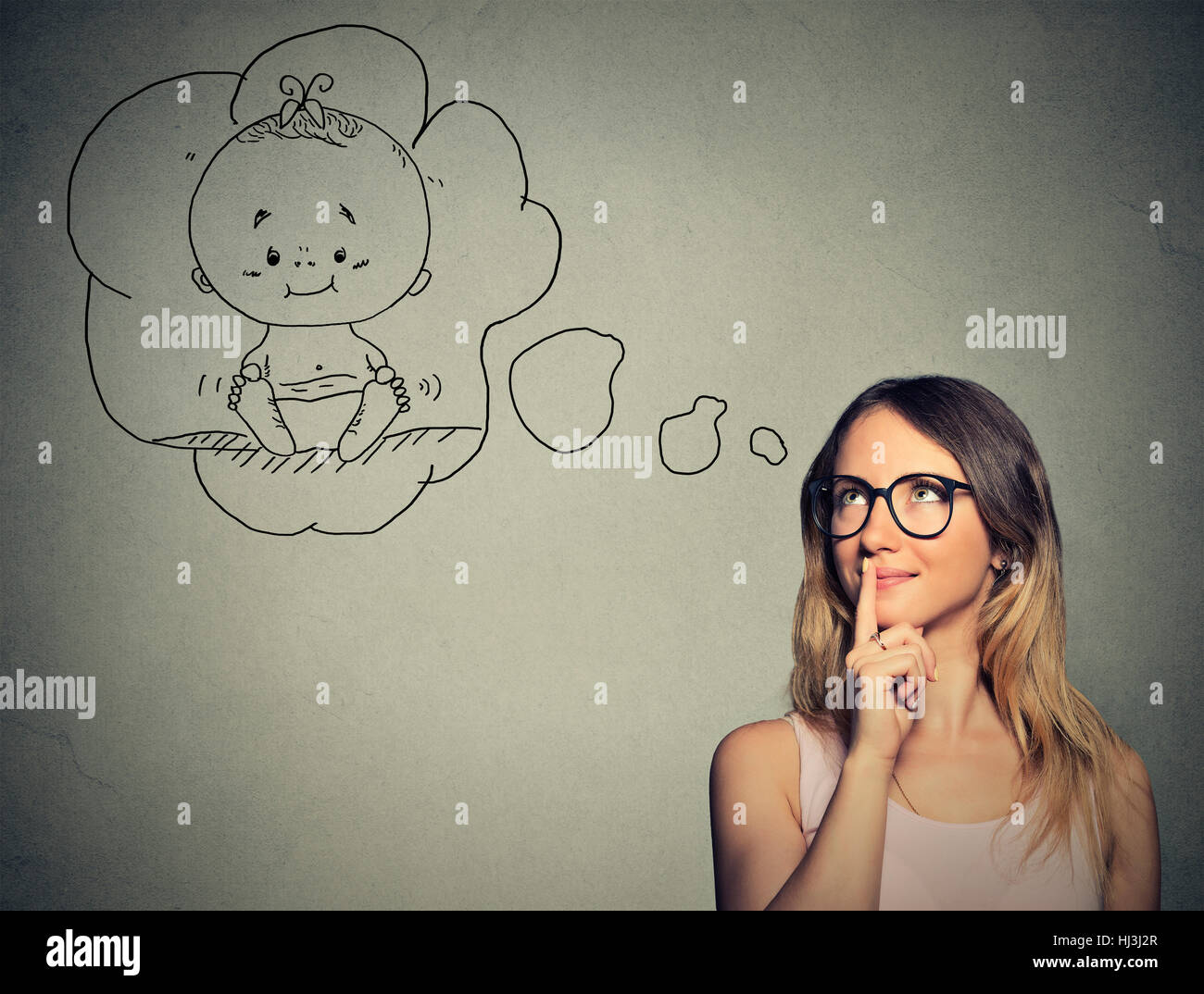 Portrait woman thinking dreaming of a child Stock Photo - Alamy