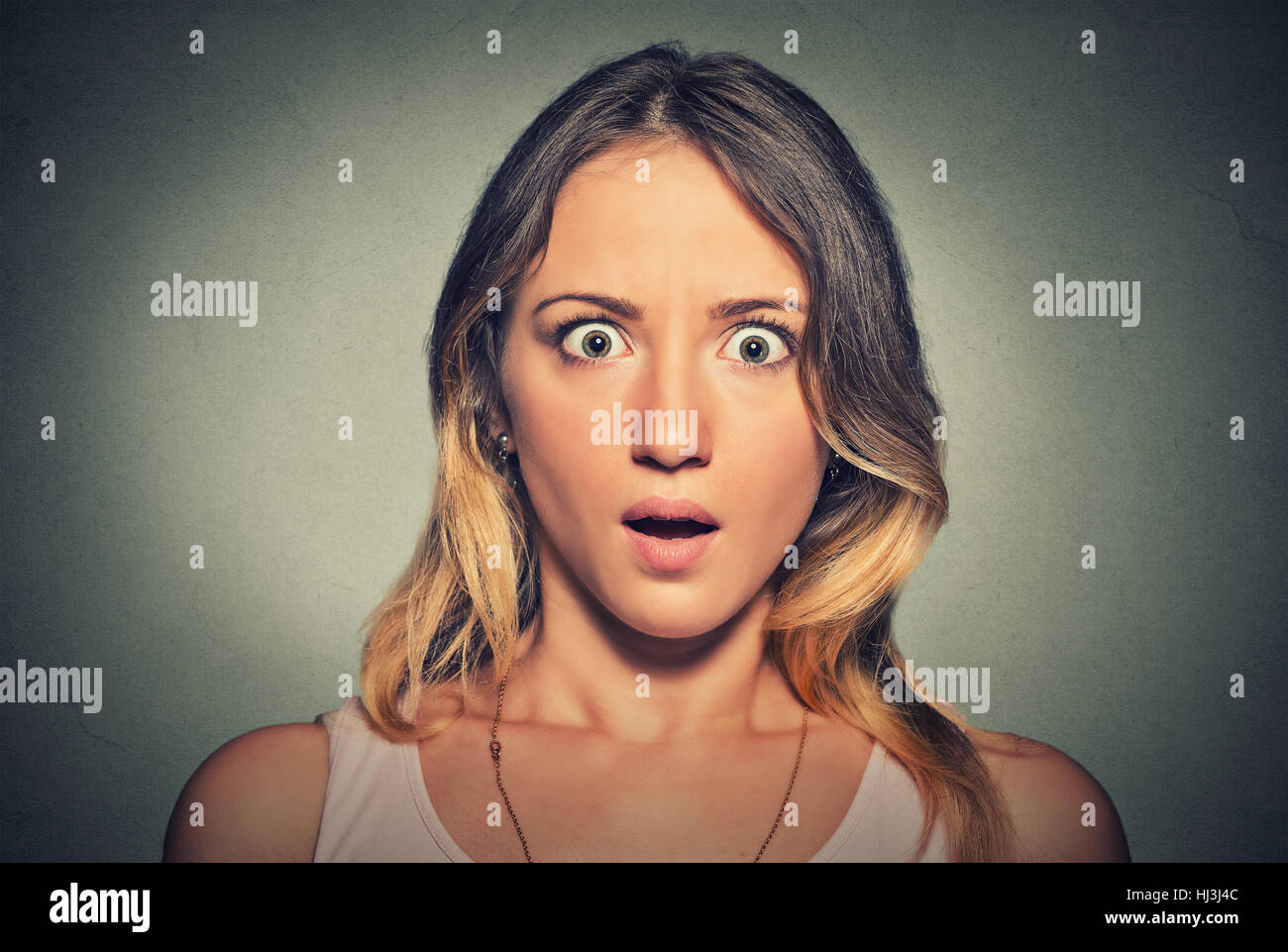 Concerned scared shocked woman Stock Photo - Alamy