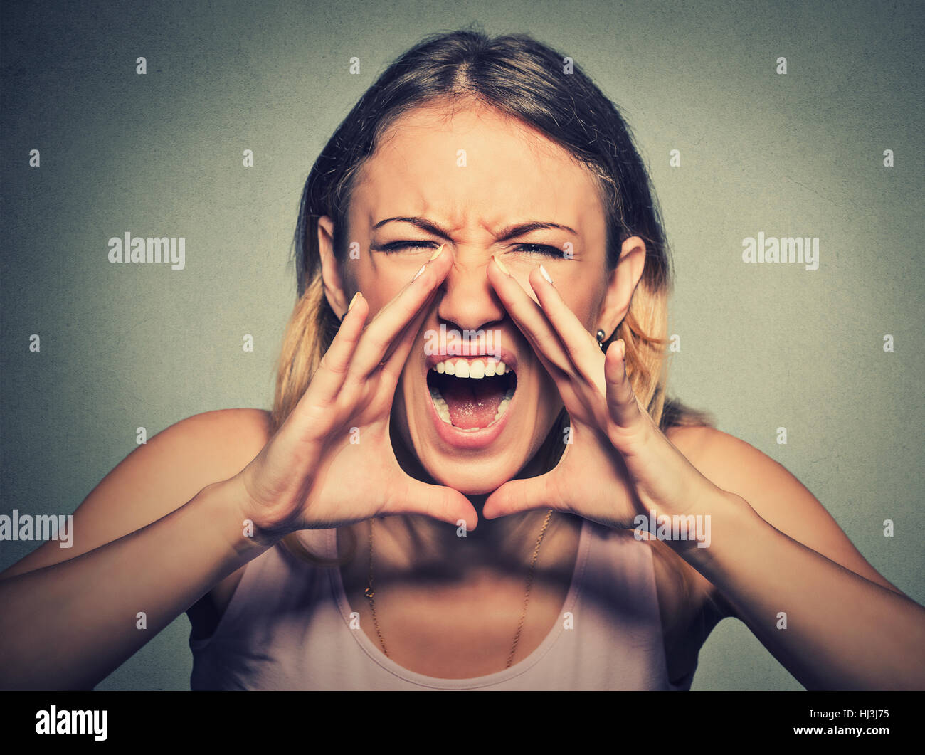 Closeup portrait angry young woman having nervous atomic breakdown ...