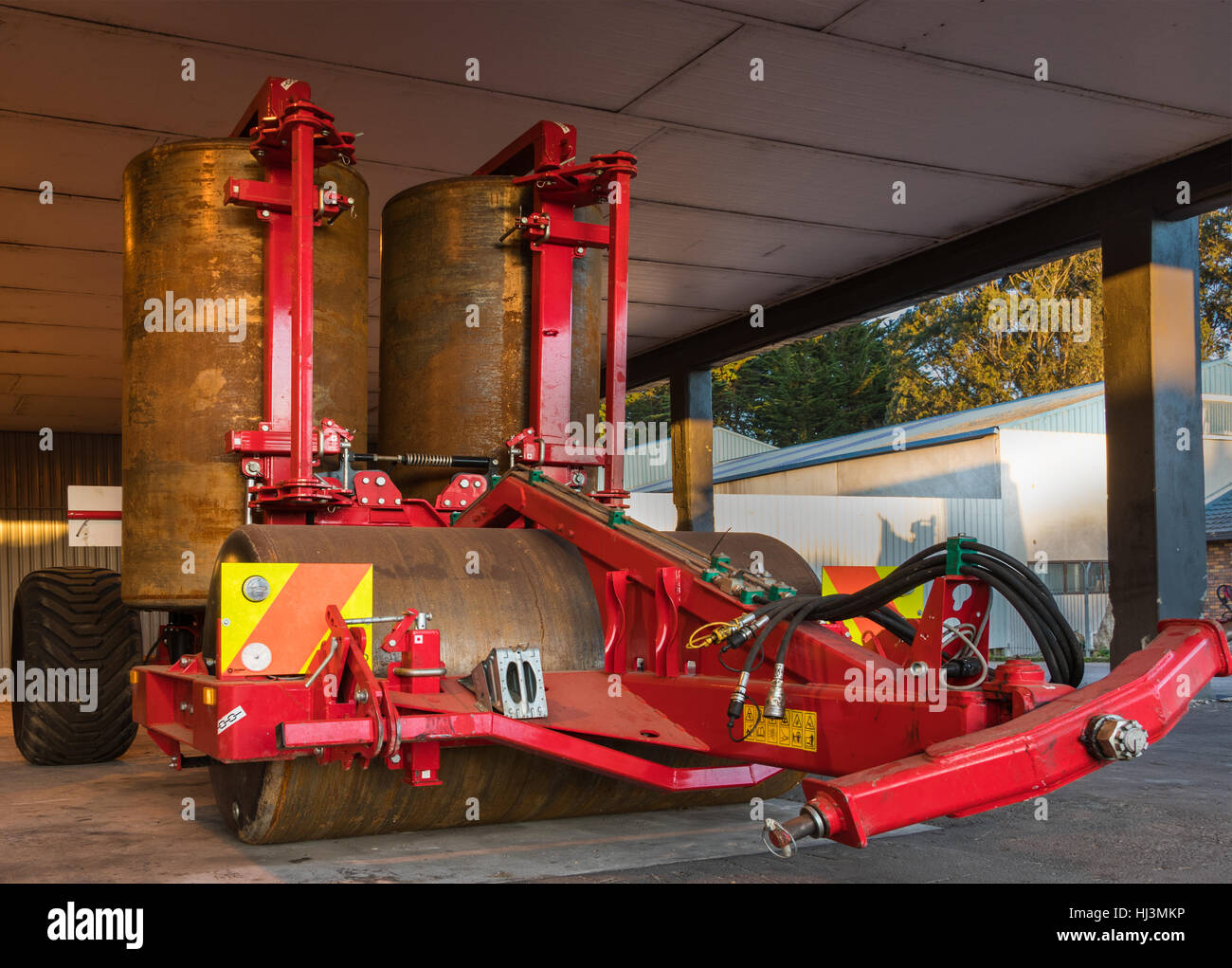 Three roller used ot flatten down rough farmland Stock Photo - Alamy