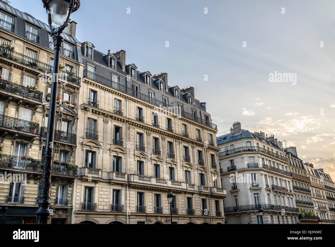 A city scape row of large buildings used as flats Stock Photo - Alamy