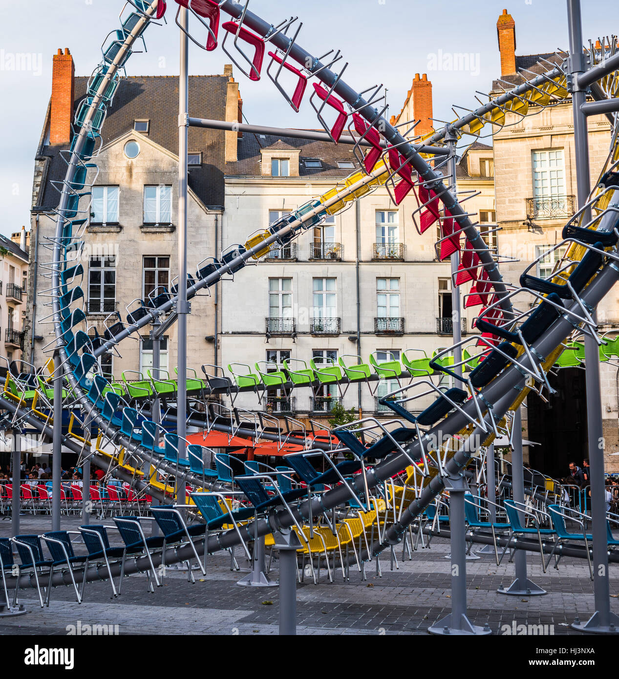 City art, chairs representing a roller coaster ride Stock Photo - Alamy