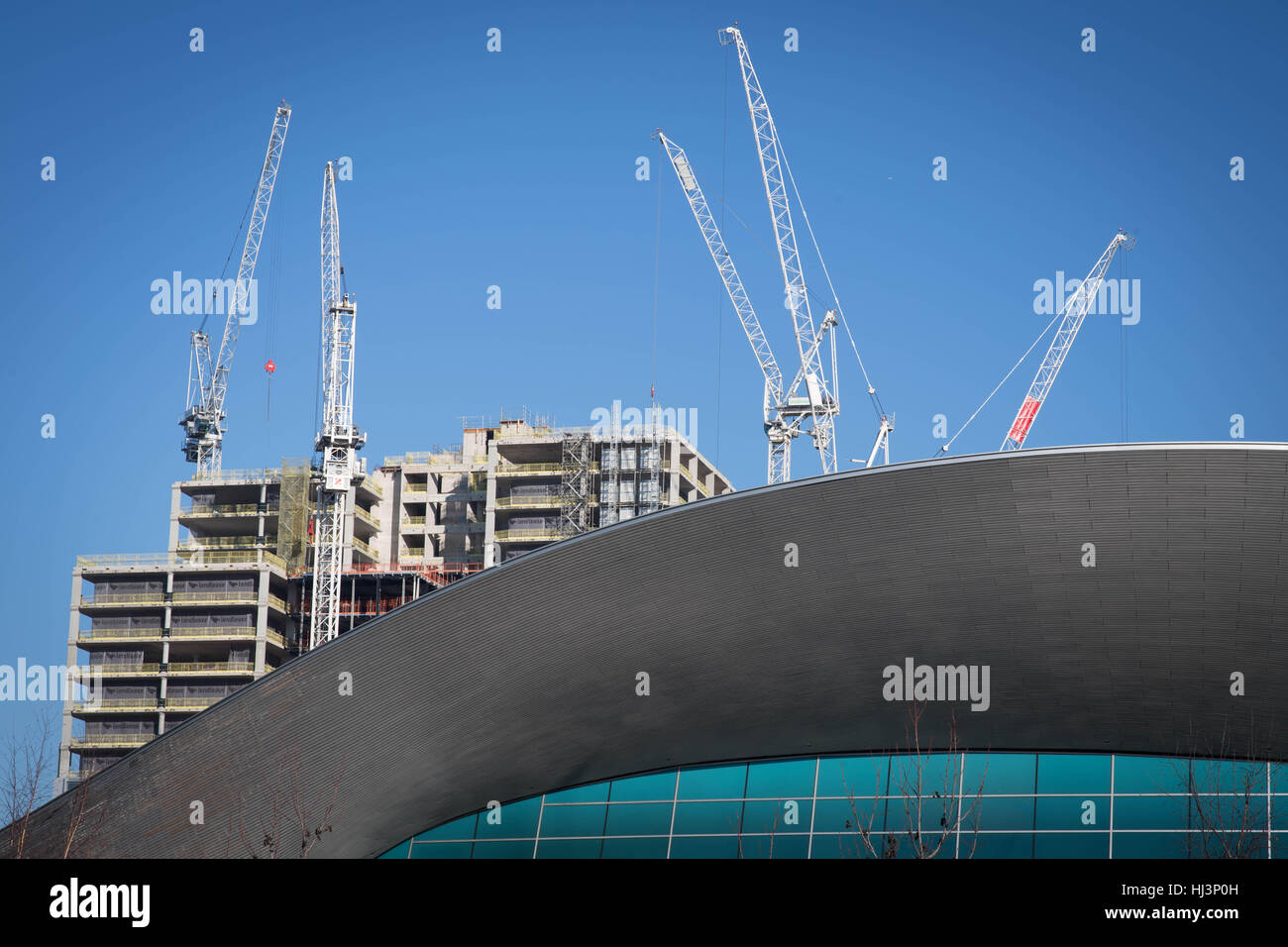 New tower blocks under construction behind the London Aquatics Centre ...