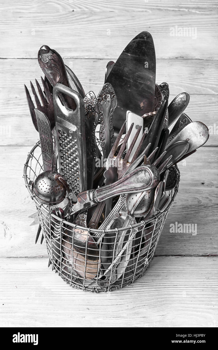 Set of table accessories of forks,spoons and knives in the wicker ...
