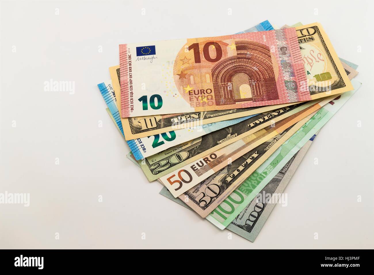US dollar bills and Euro bills spread mixed on white background Stock ...