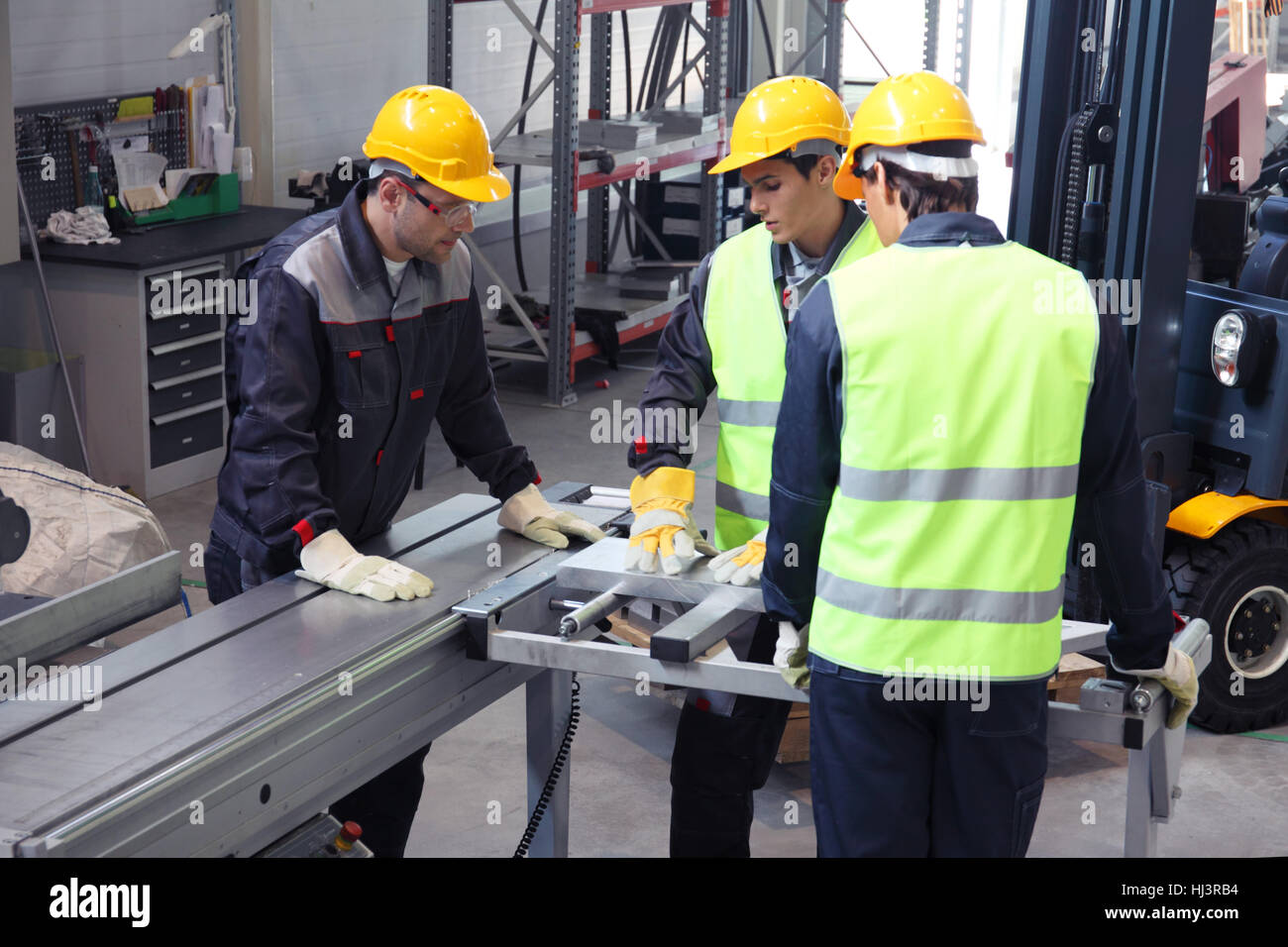 Workers in uniform in CNC machine shop with lathes Stock Photo - Alamy