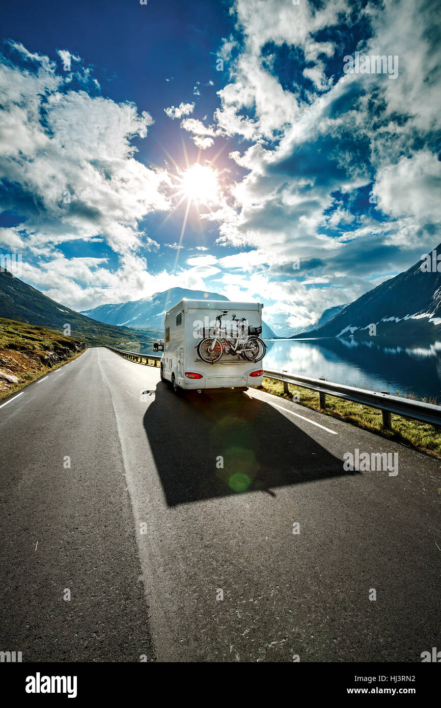 Caravan car travels on the highway Stock Photo - Alamy
