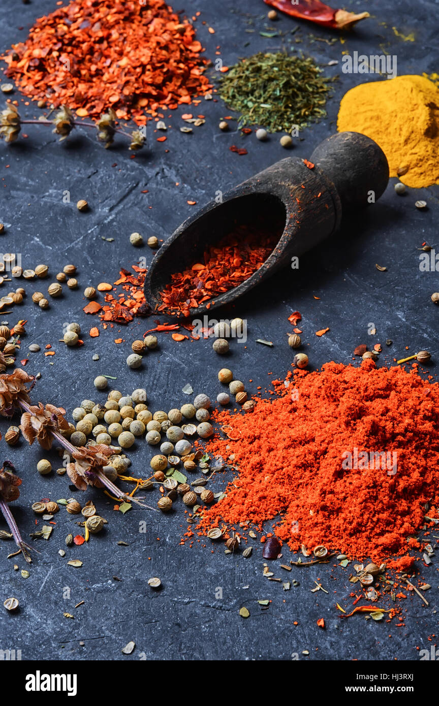 large set spicy spices in spoons on slate background Stock Photo - Alamy
