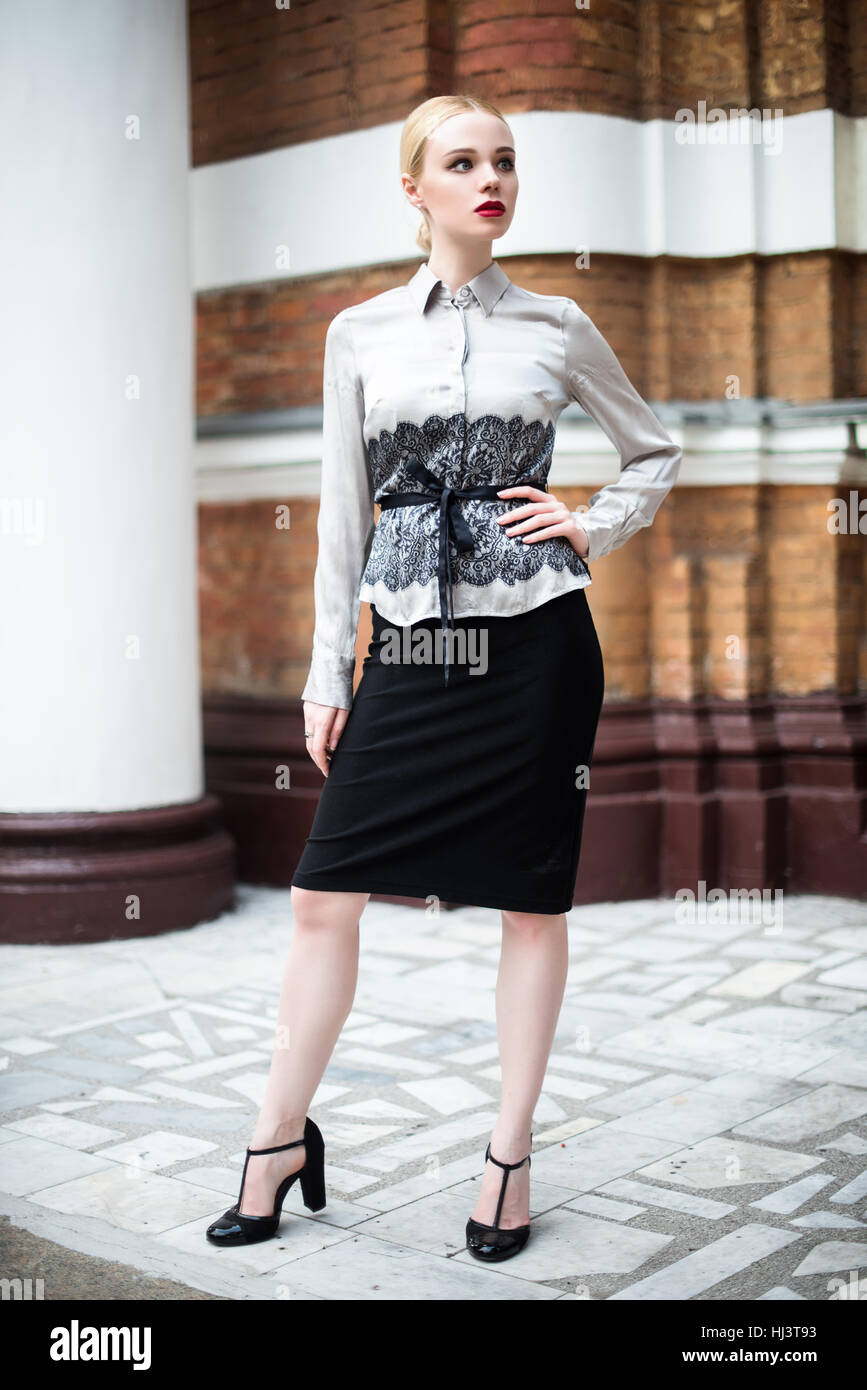 Pretty young business woman wearing formal clothes Stock Photo - Alamy