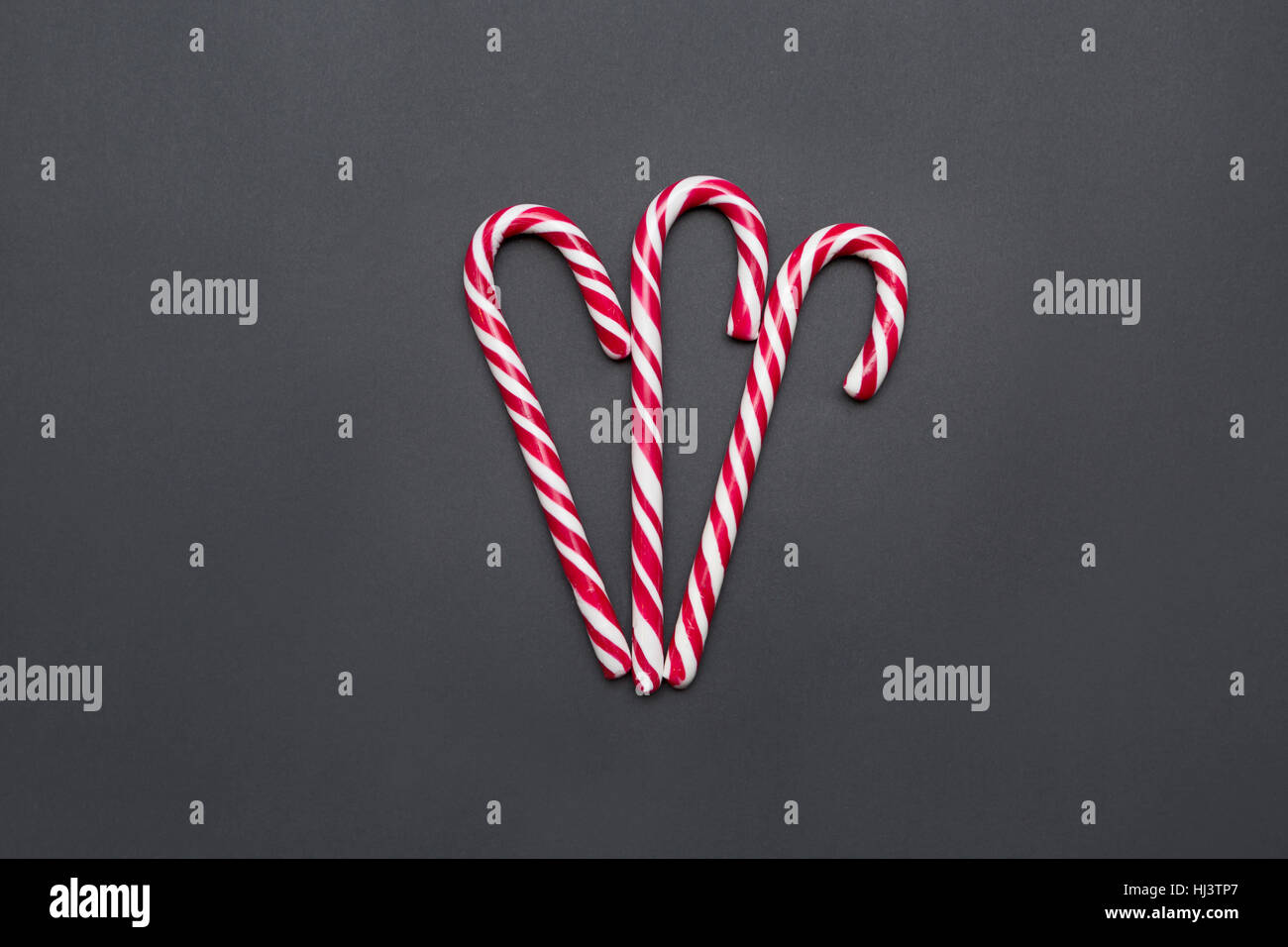 Three Candy Canes Together Stock Photo - Alamy