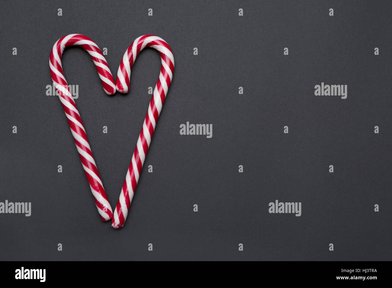 Two Candy Canes Making a Heart Stock Photo - Alamy