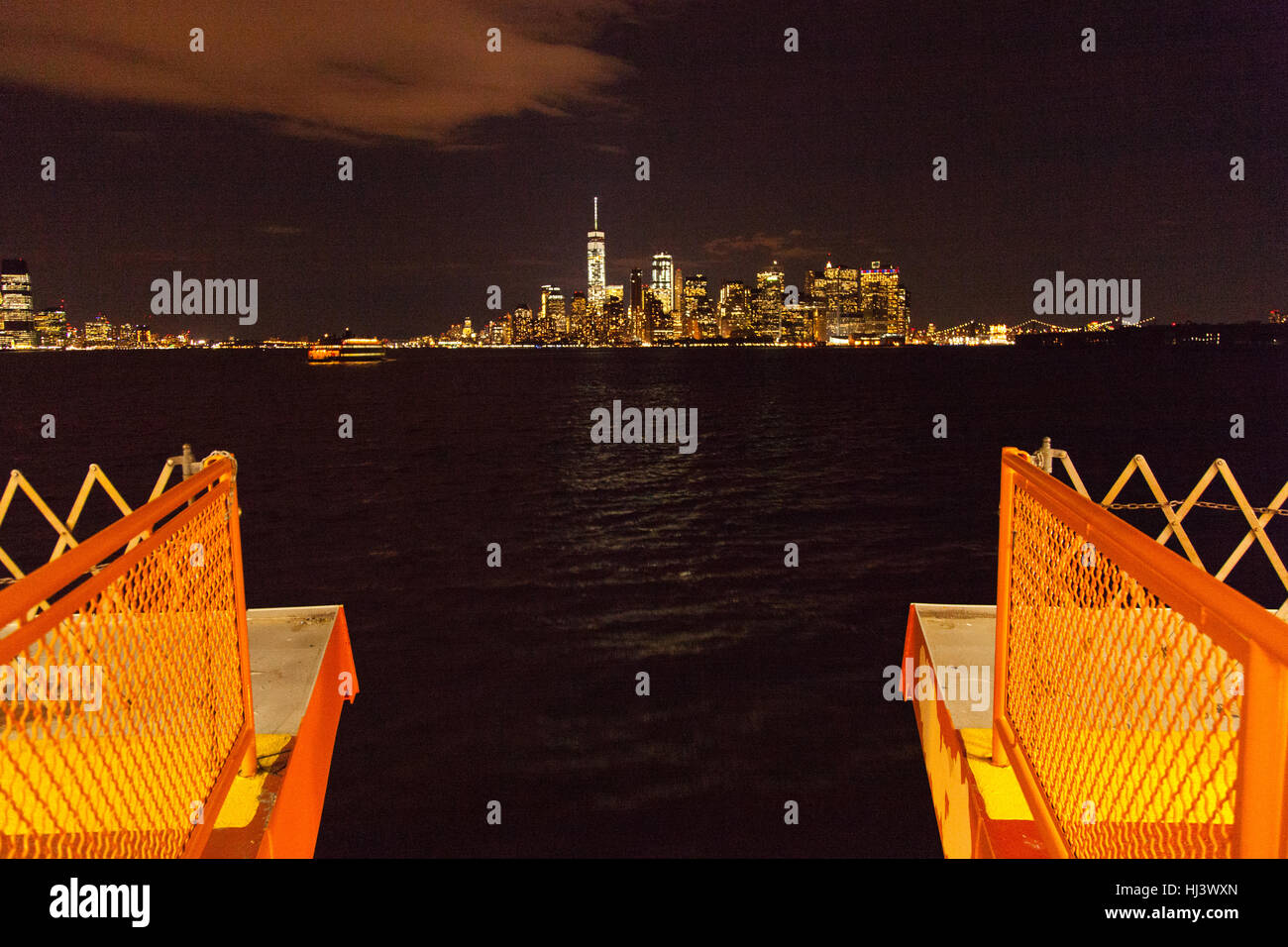 Manhattan island at night photographed from the Staten island Ferry ...