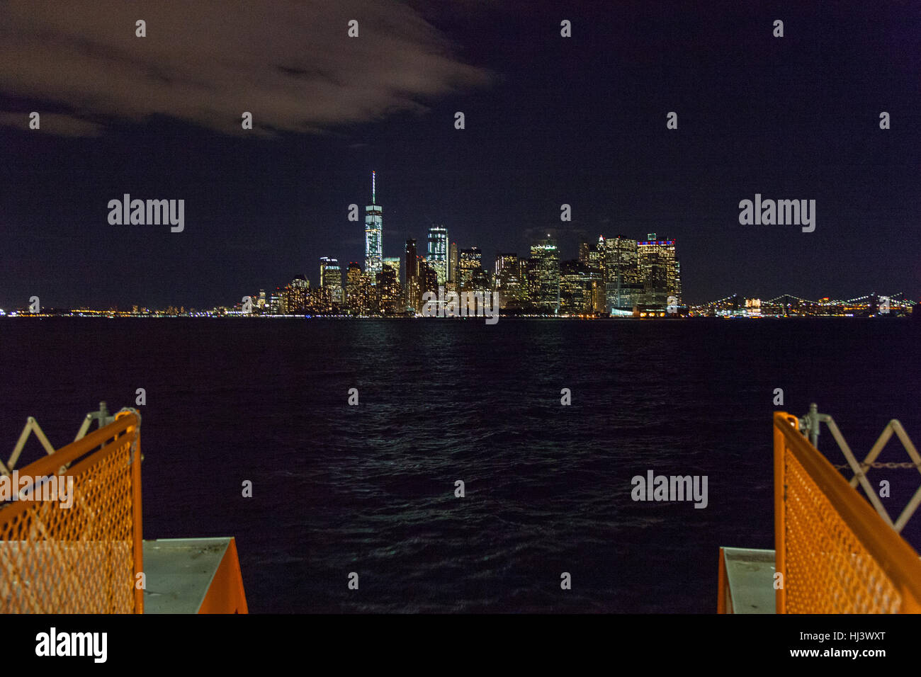 Manhattan island at night photographed from the Staten island Ferry ...