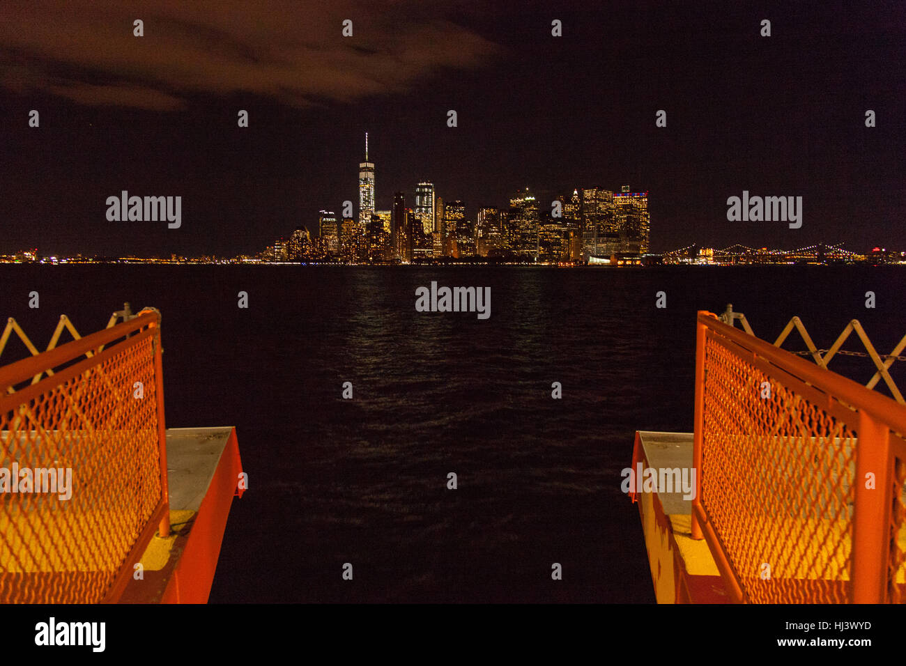 Manhattan island at night photographed from the Staten island Ferry ...