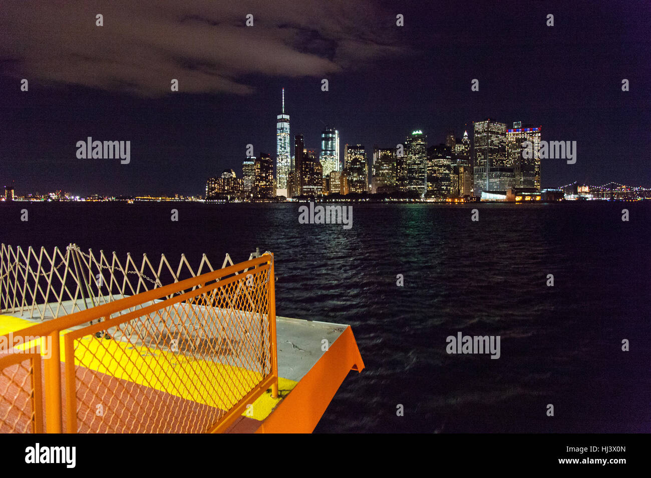 Manhattan island at night photographed from the Staten island Ferry ...