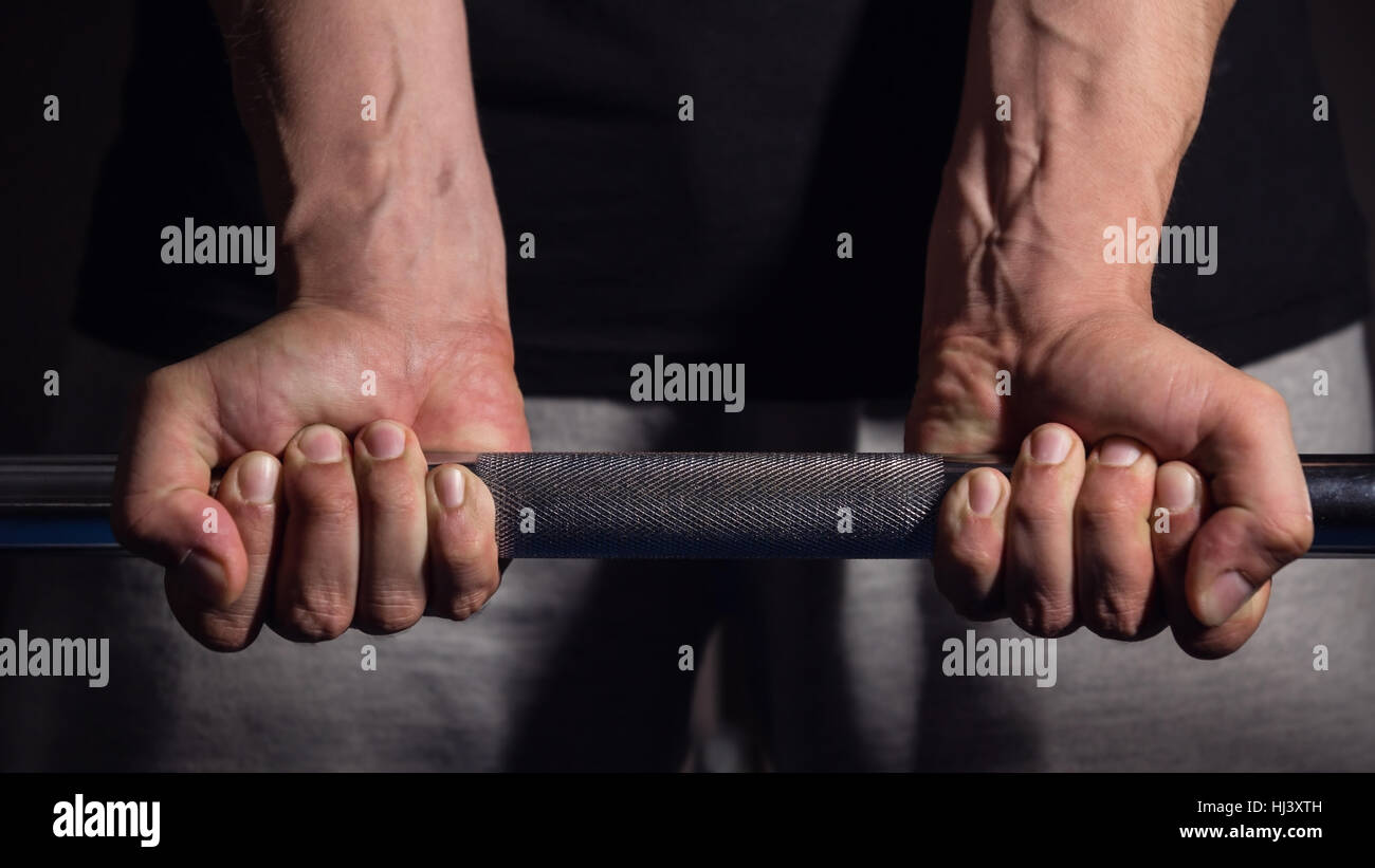 Man preparing to Lift Up Heavy Barbell Stock Photo - Alamy