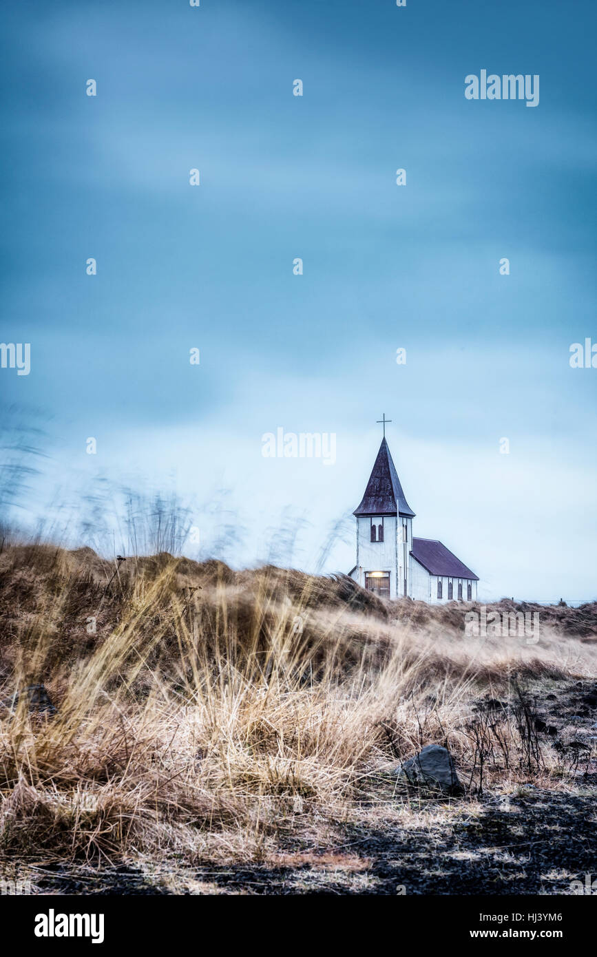 An old church in a remote countryside in Iceland during a rainy, stormy ...