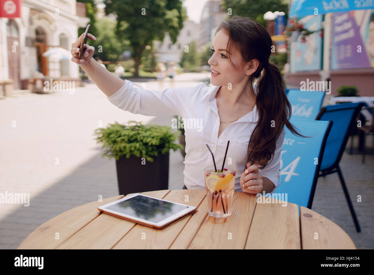business woman enjoys gadgets Stock Photo - Alamy