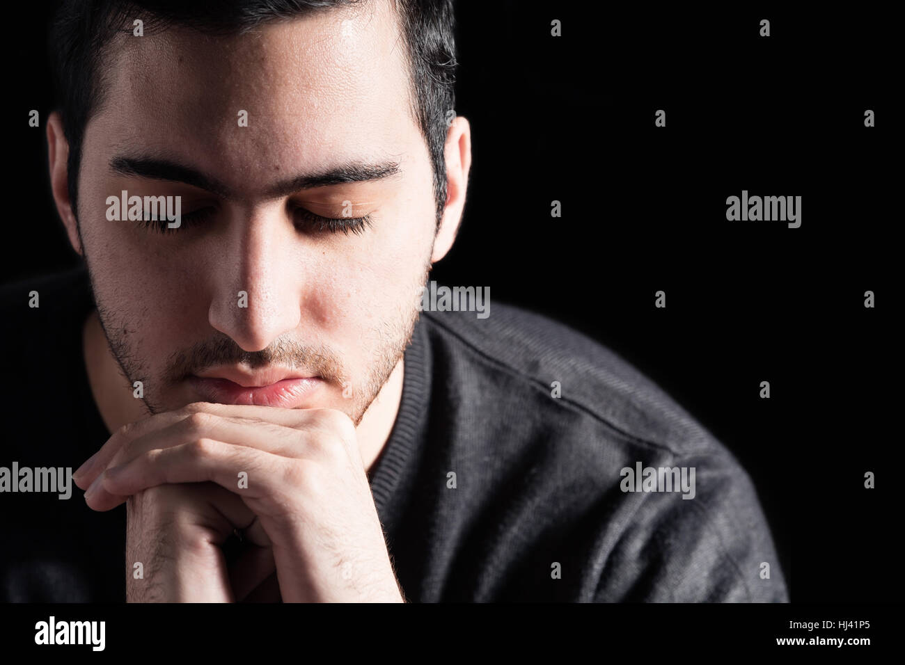 Young Man Praying Stock Photo - Alamy
