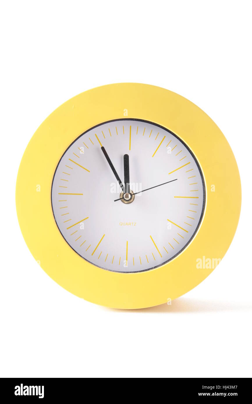 Yellow, round clock with hands on white background Stock Photo - Alamy