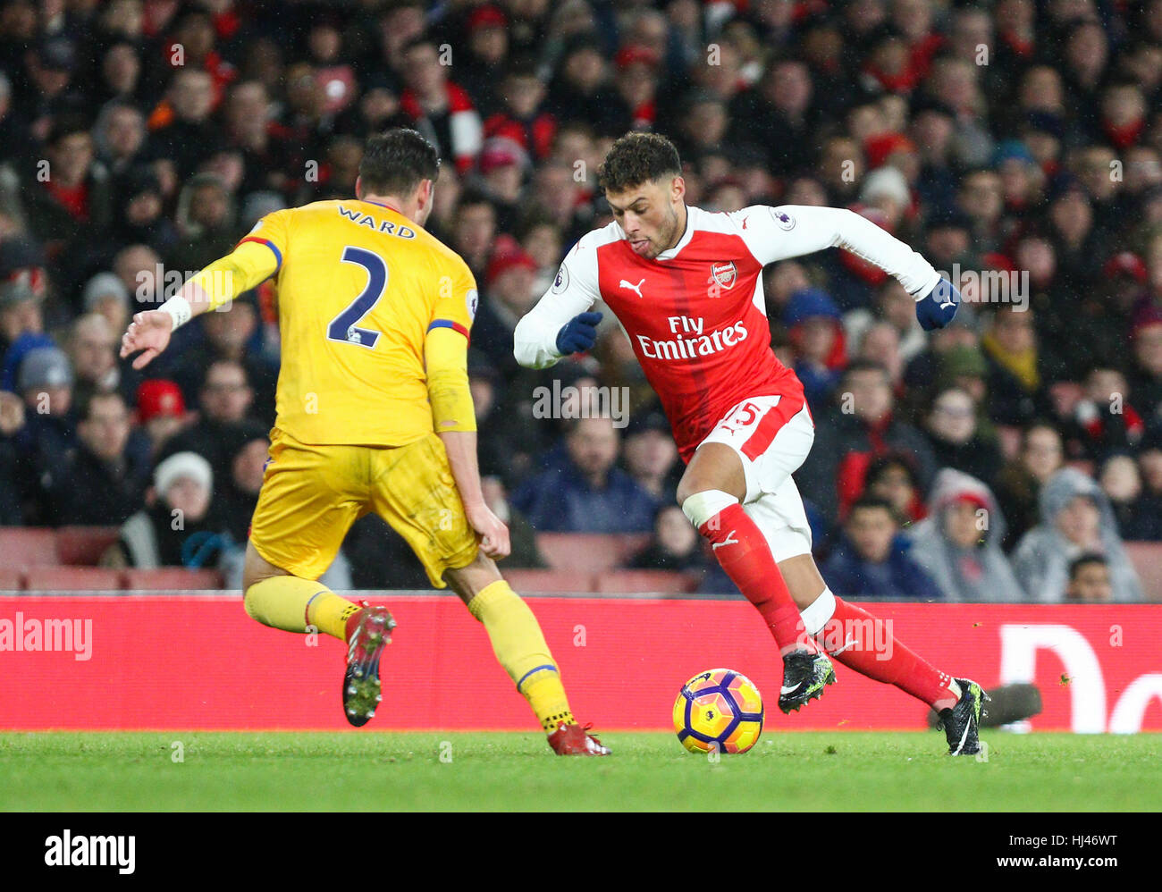 Alex Oxlade-Chamberlain of Arsenal runs at Joel Ward of Crystal Palace ...