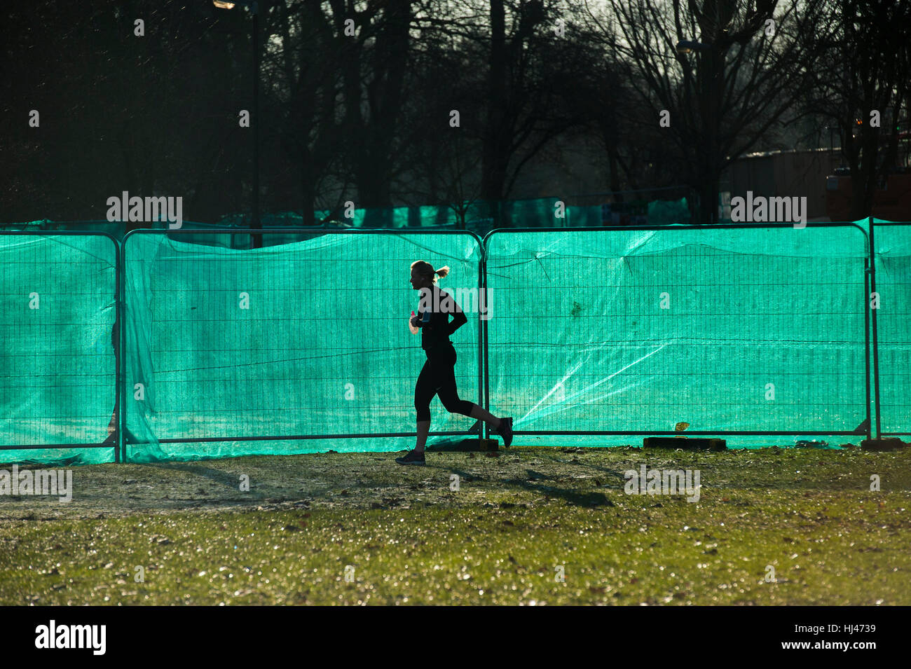 Running past a building site in London Stock Photo - Alamy