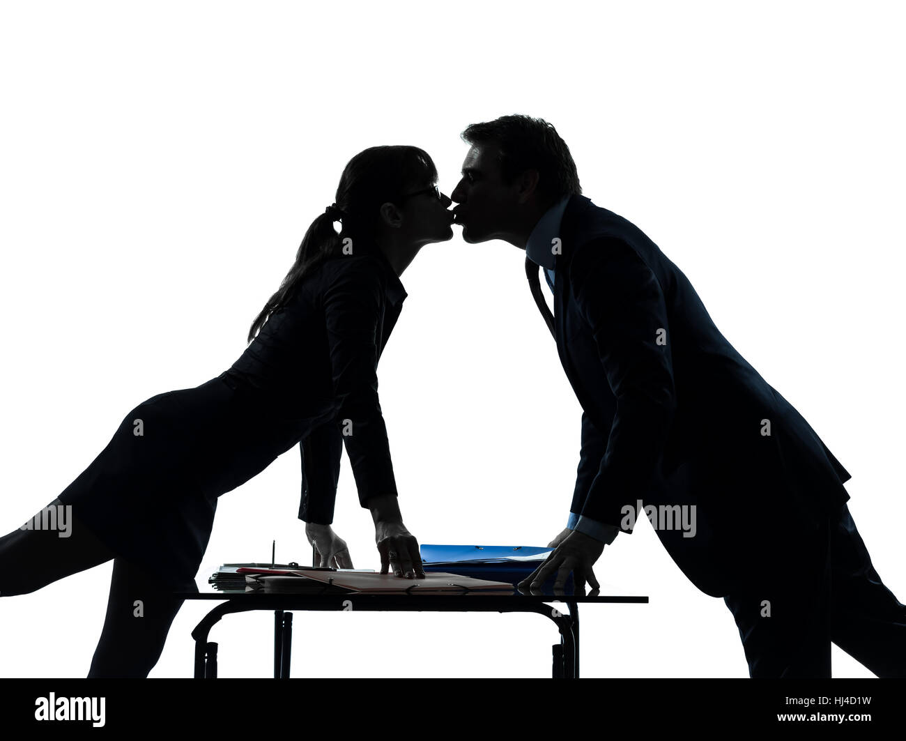 One Caucasian Business Woman Man Couple Lovers Kissing In Silhouette