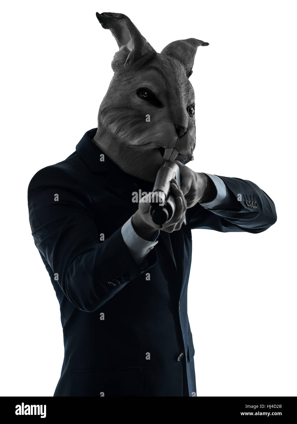 one caucasian man rabbit mask hunting with shotgun portrait in ...