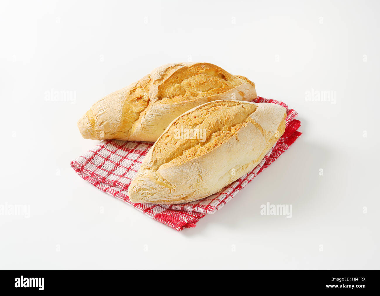 fresh diamond shaped ciabatta bread on checkered dishtowel Stock Photo ...