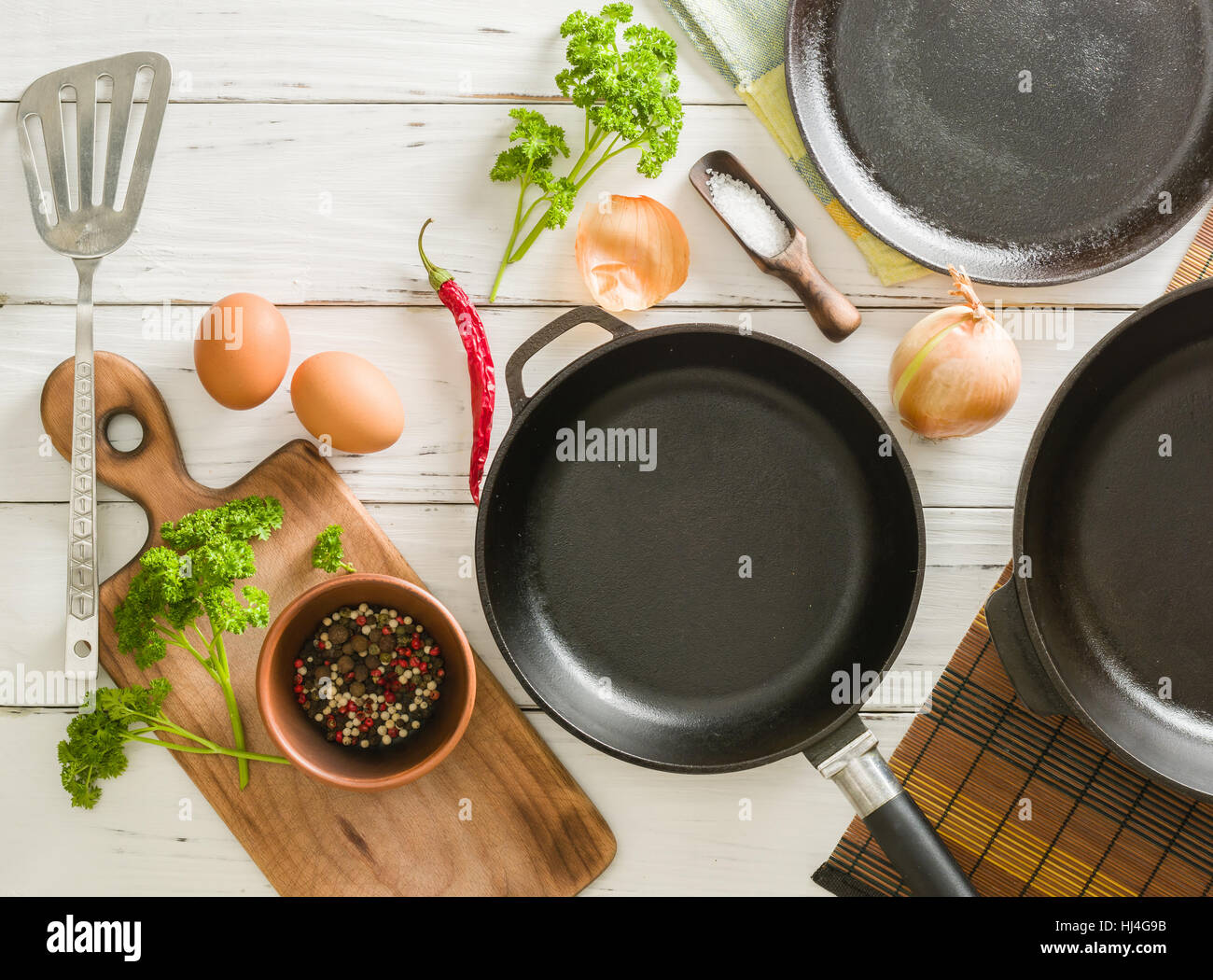 Morning breakfast. Cooking eggs. Frying pan and ingredients: onions ...