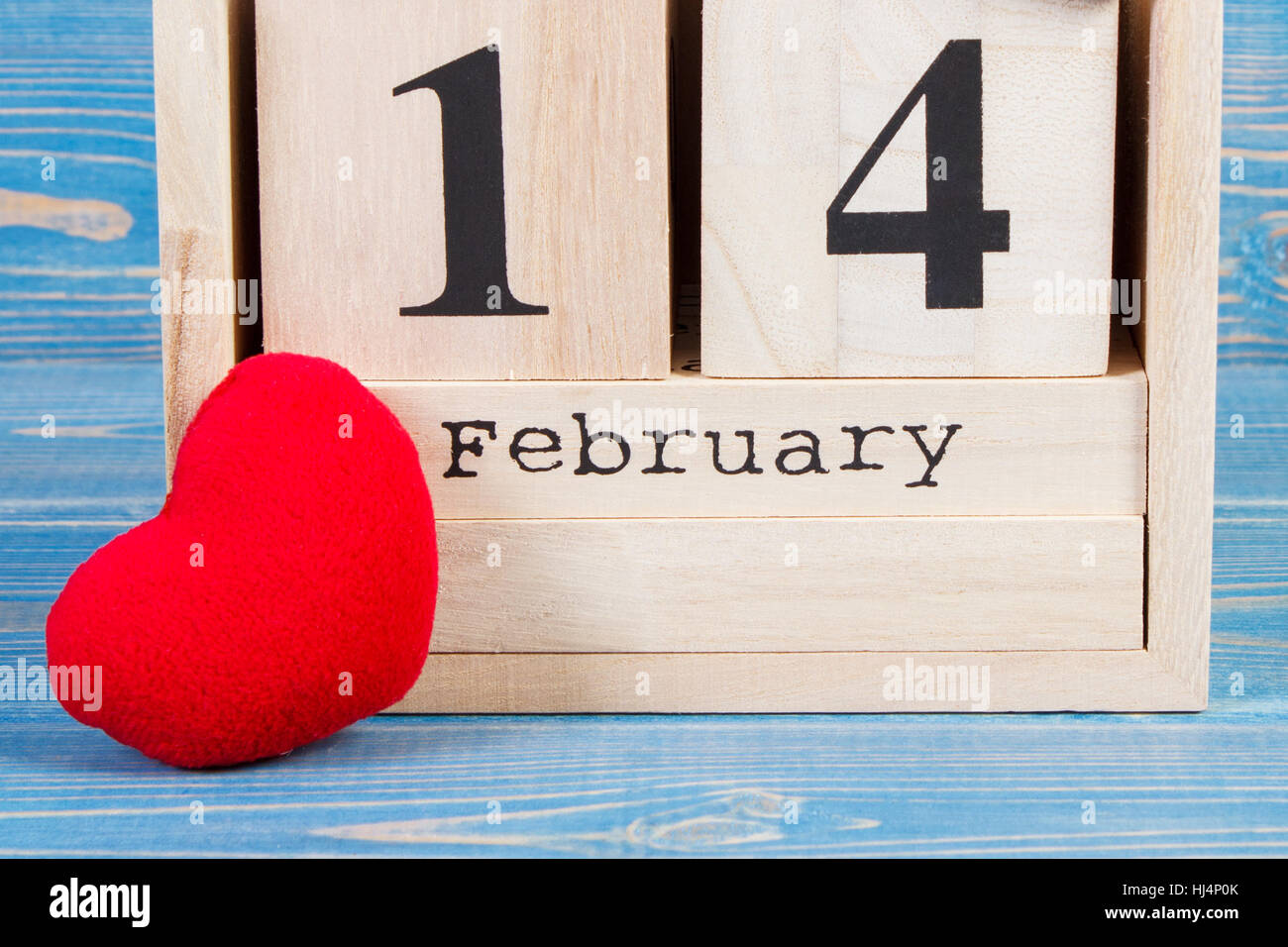 February 14 on cube calendar and red heart, decoration for Valentines ...
