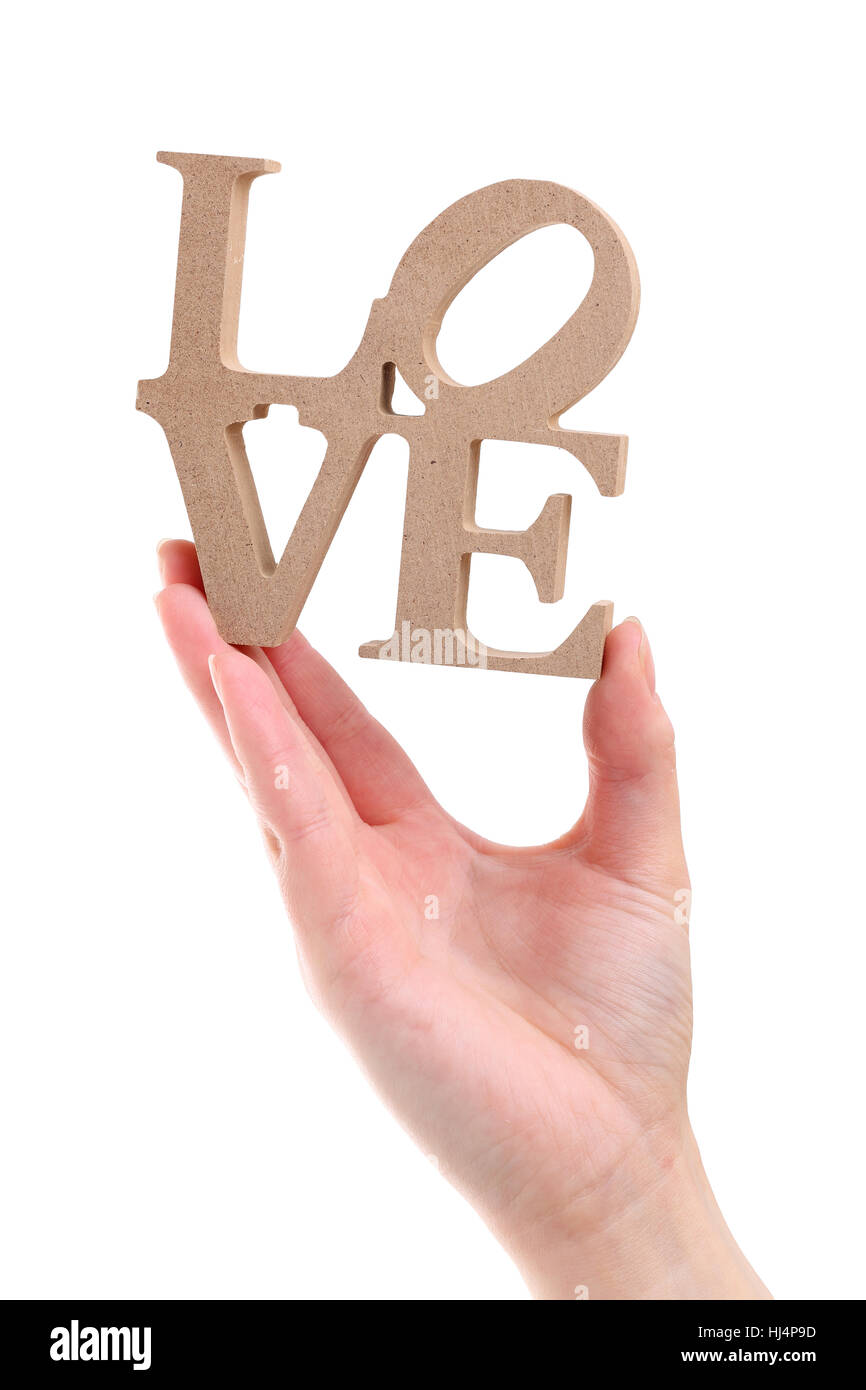 Hand holding block wooden letters, word love Stock Photo - Alamy