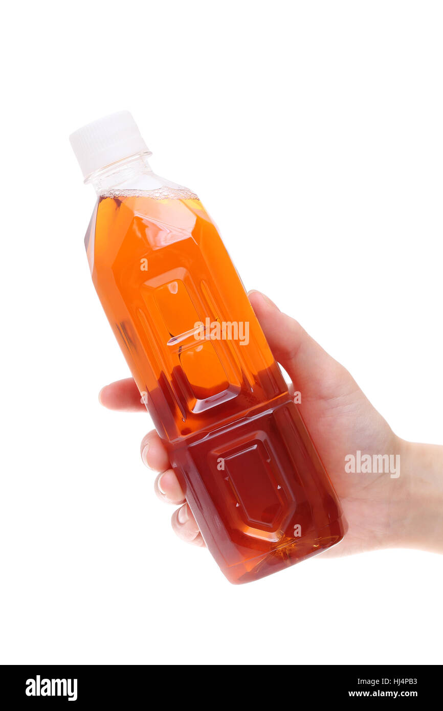 Hand holding bottle of tea isolated on white background Stock Photo - Alamy