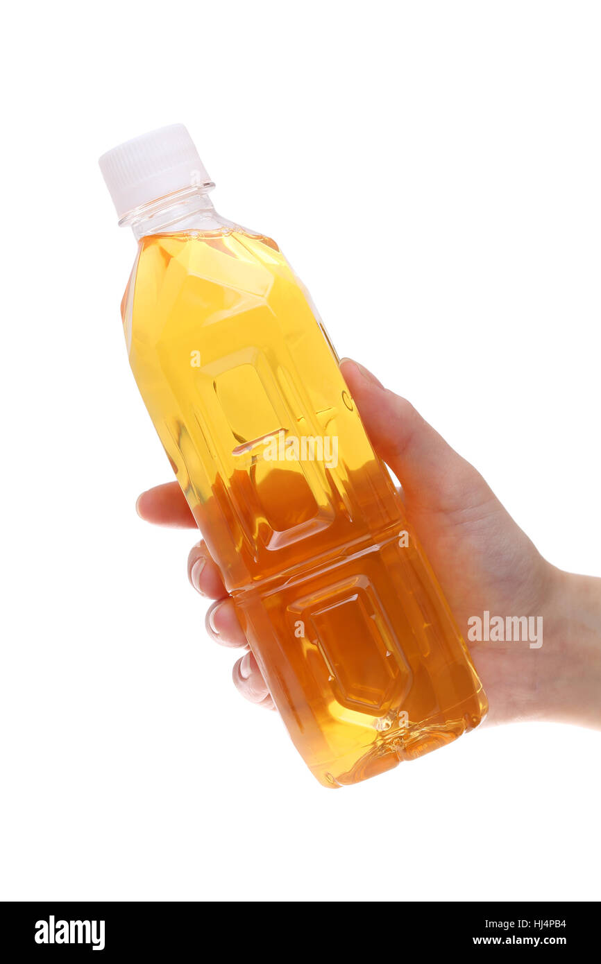 Hand holding bottle of tea isolated on white background Stock Photo - Alamy