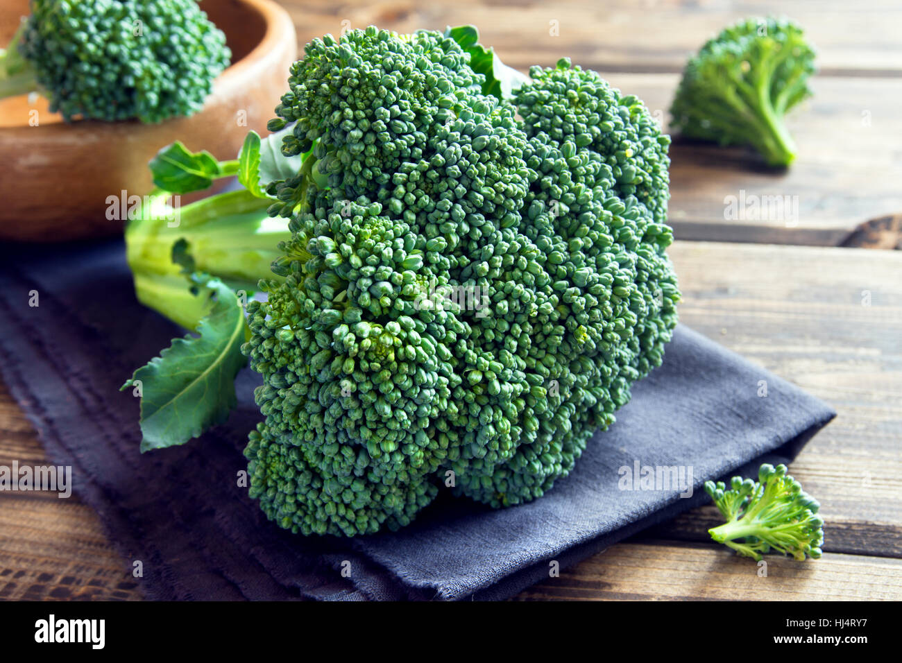 Healthy green organic raw broccoli on wooden table - ingredient ready ...