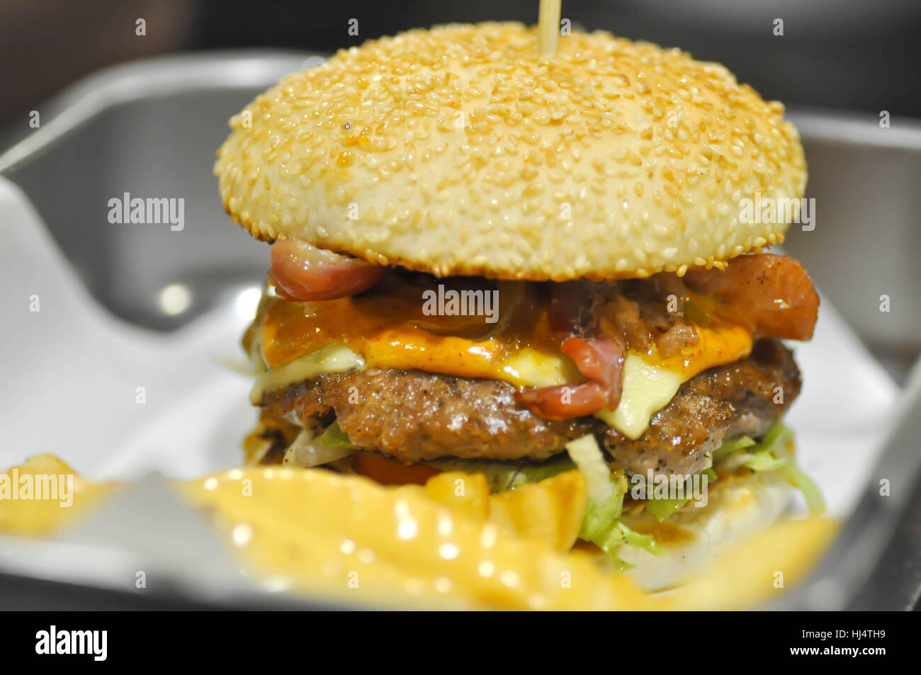 beef burger with cheese , sesame and vegetable Stock Photo - Alamy
