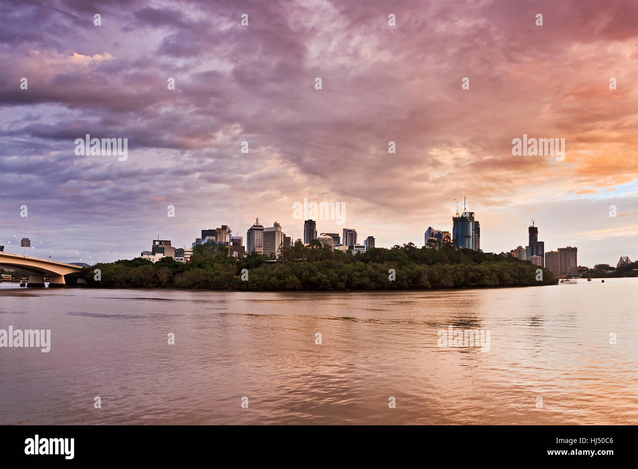 Brisbane city CBD view across Brisbane river over parkland and ...