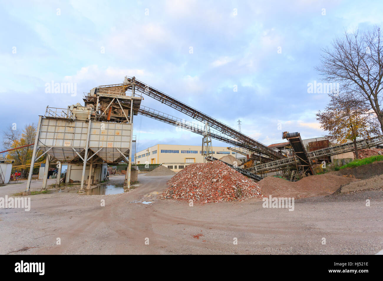 Stone quarry with silos and conveyor belts. Industrial equipment ...