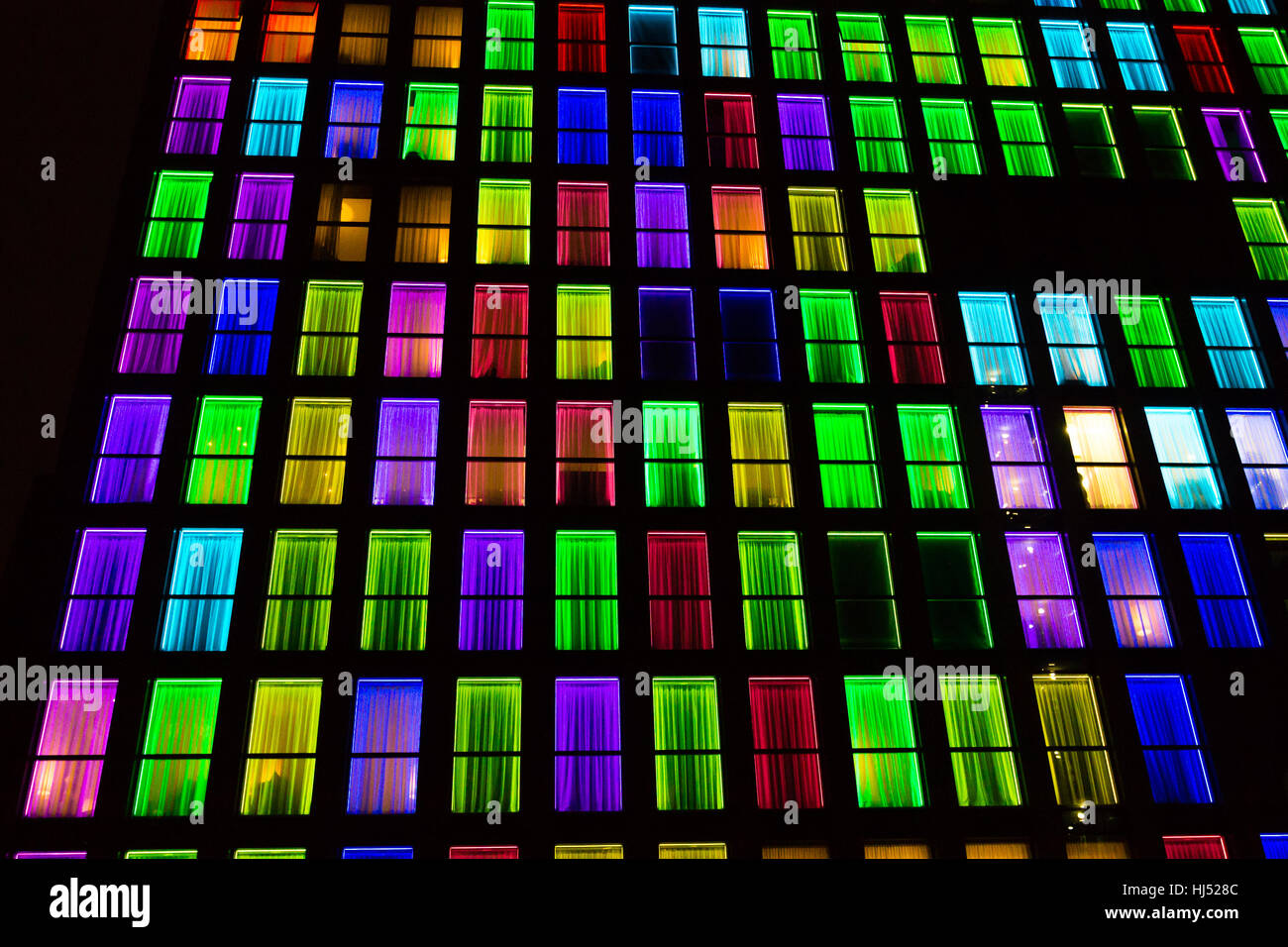 Colored windows texture. Windows illuminated by neon lights background ...