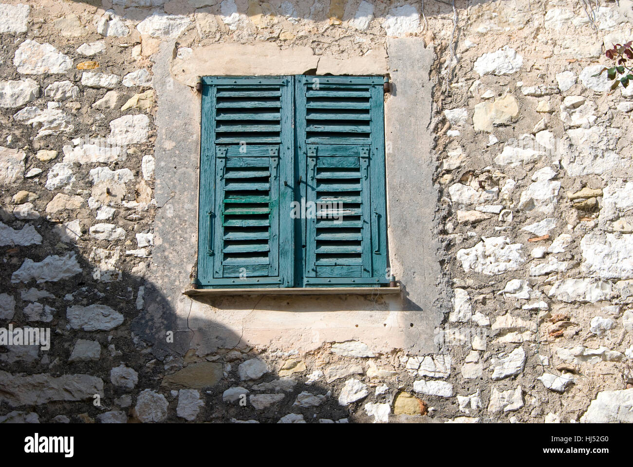 turquoise window in french steinhaus Stock Photo - Alamy