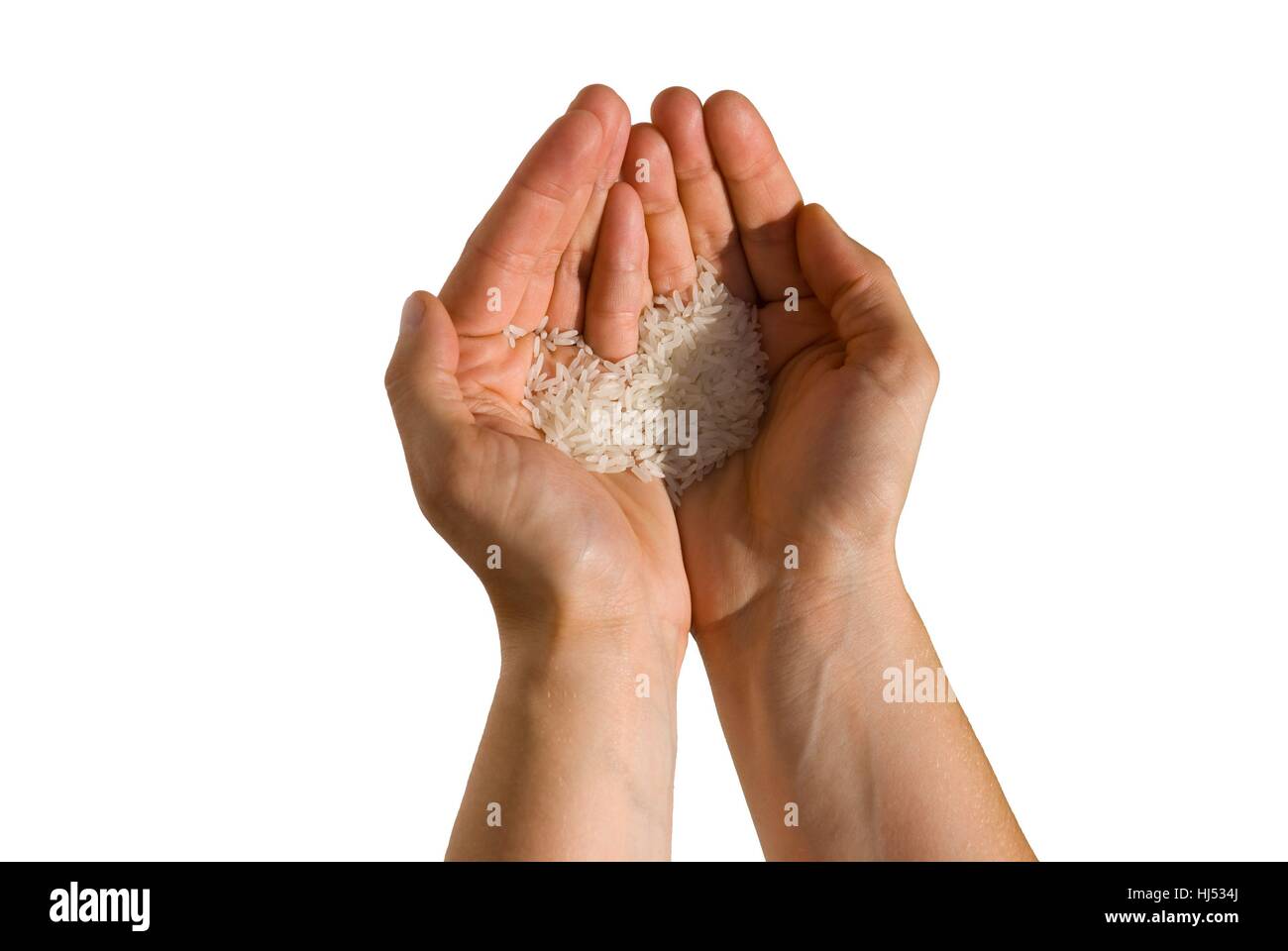 two hands holding rice in it Stock Photo - Alamy