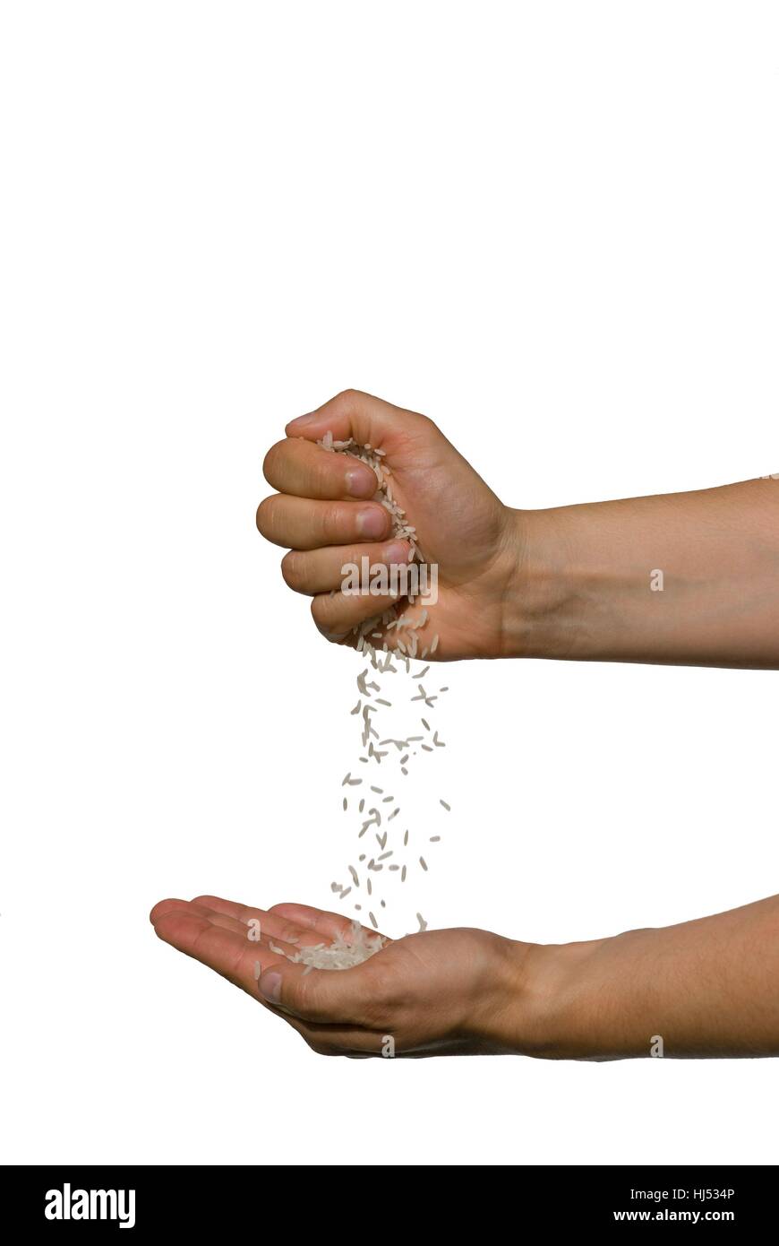 rice flowing from one hand to another Stock Photo - Alamy