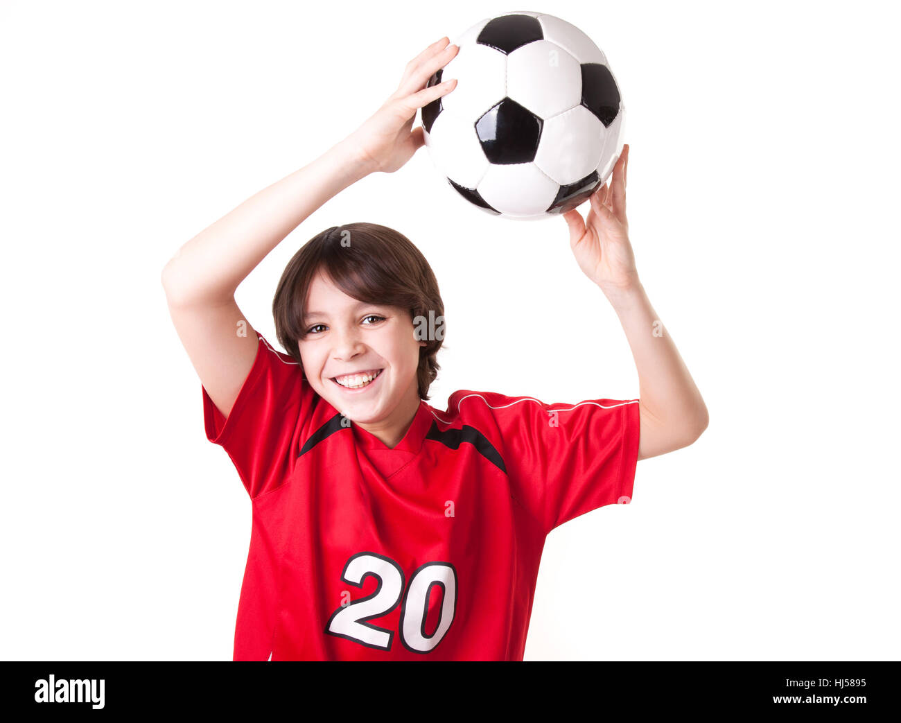 boy raises ball over his head Stock Photo - Alamy