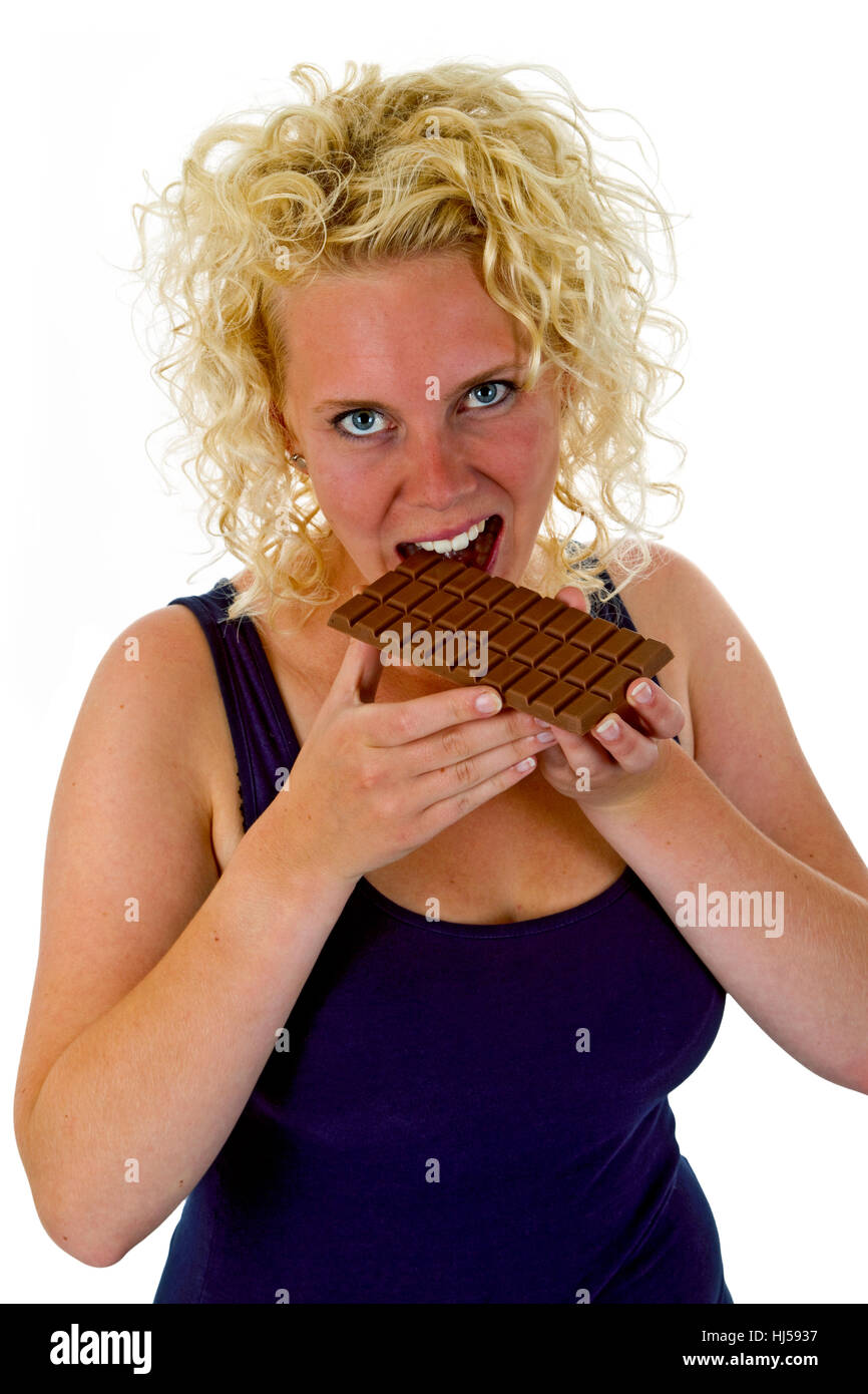 young woman eating chocolate bar Stock Photo - Alamy