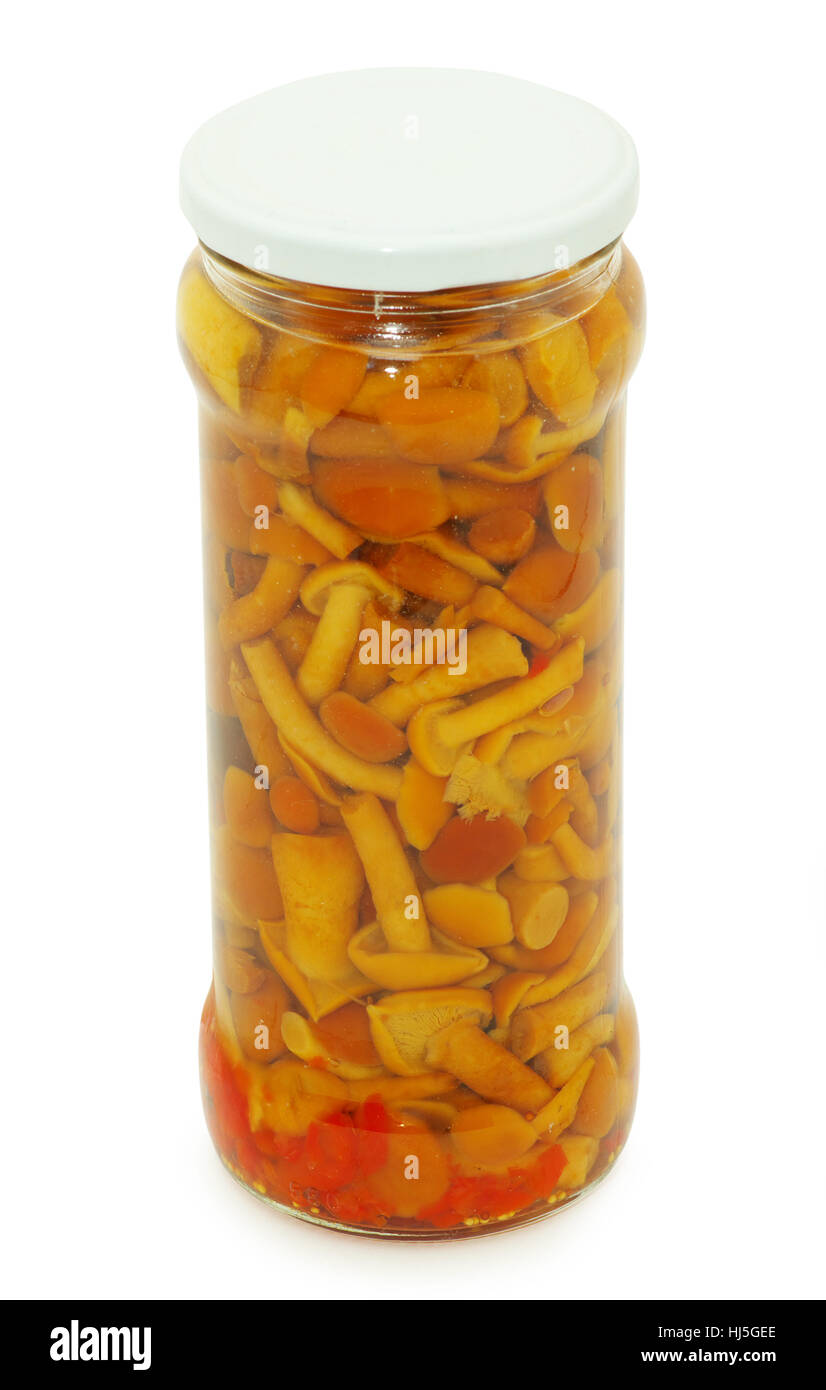 Glass jar with marinated fungus isolated on the white background Stock ...