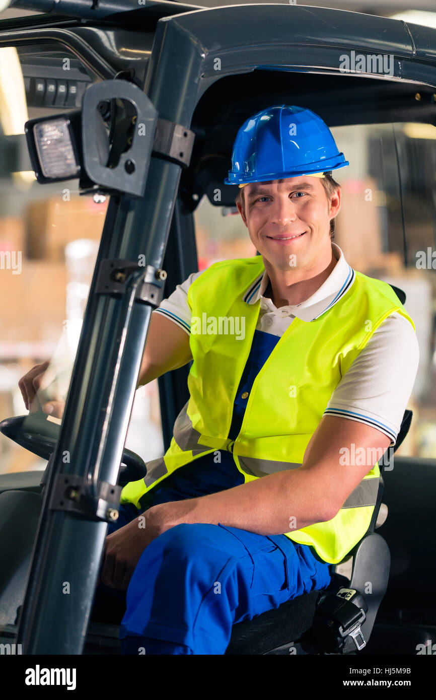forklift operator in warehouse of freight forwarding Stock Photo - Alamy